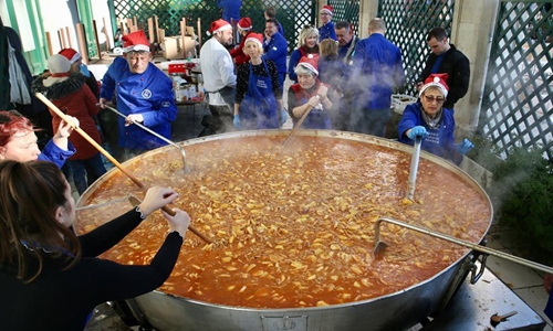 Locals cook cod fish stew to celebrate Christmas in Zagreb, Croatia ...