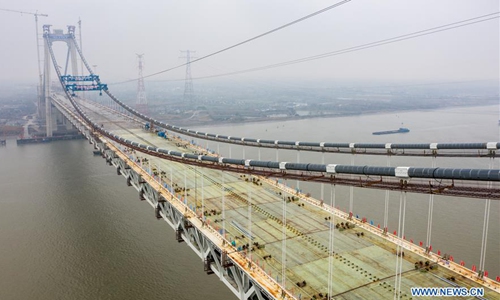 China's first suspension bridge integrating expressway, railway ...