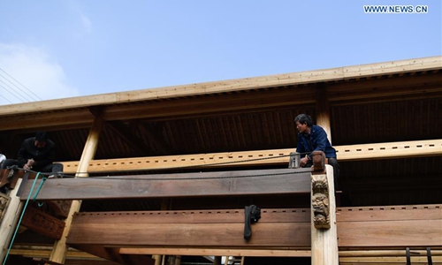 Craftsmen repair traditional theatrical stage in China's Zhejiang ...
