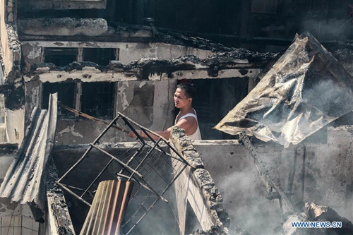 Aftermath of fire at residential area in Manila, the Philippines ...