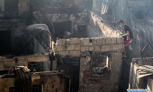 Aftermath of fire at residential area in Manila, the Philippines ...