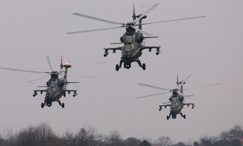 Attack helicopters lift off from parking apron - Global Times