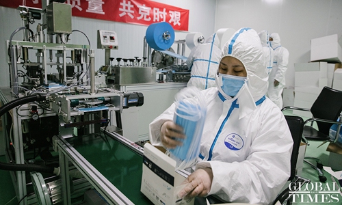 Beijing factory gears up for mask production - Global Times