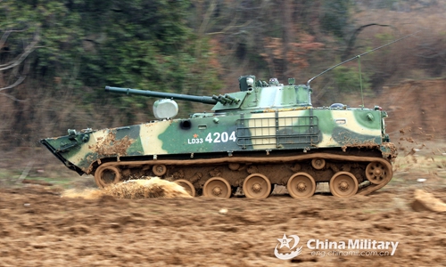 MBTs and IFVs pass through muddy road - Global Times