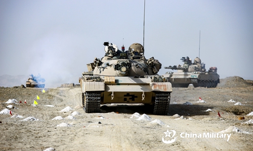 MBTs pass through man-made obstacles - Global Times