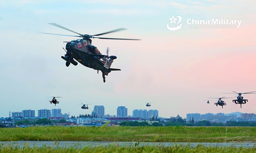 Attack helicopters fly at ultra-low altitude - Global Times