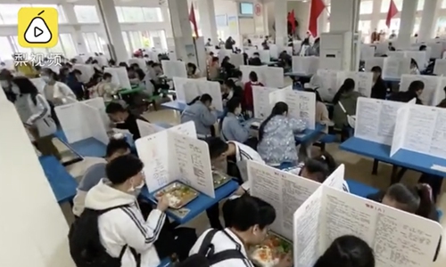 Primary school students from Northwest China eating at staggered times ...