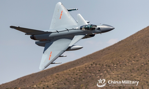 J-10 fighter jet flies over paddy field - Global Times