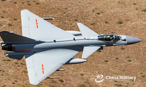 J-10 fighter jet flies over paddy field - Global Times