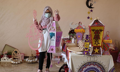 People wear protective mask to prepare ornaments for Islamic holy month ...
