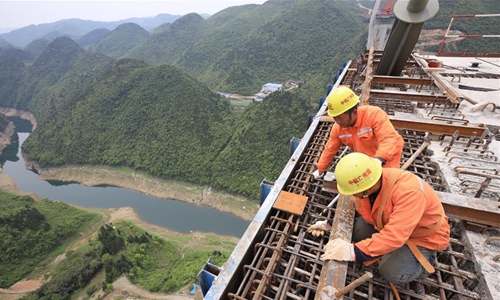 In pics: construction site of Xiangjiang bridge in SW China - Global Times