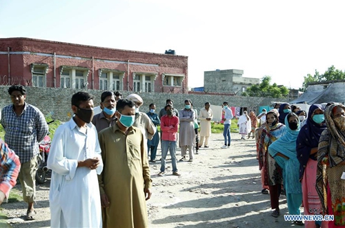 Welfare organization distributes food supply items among 60 families in ...