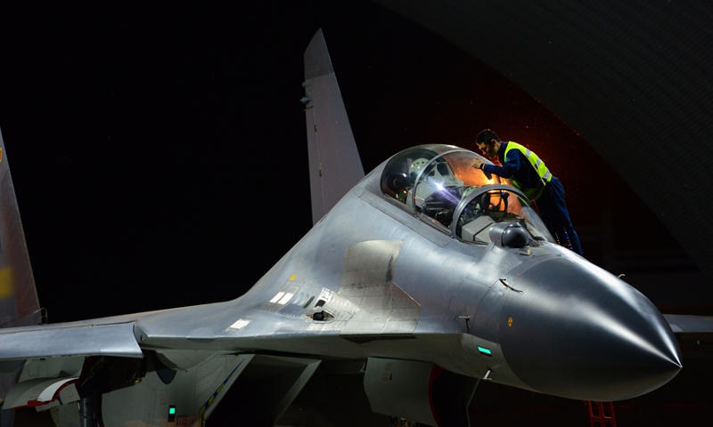 Ground crews use flags to guide fighters - Global Times