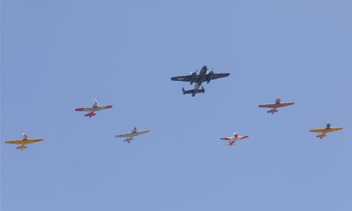 Historic warplanes fly over Dallas in salute to frontline workers ...