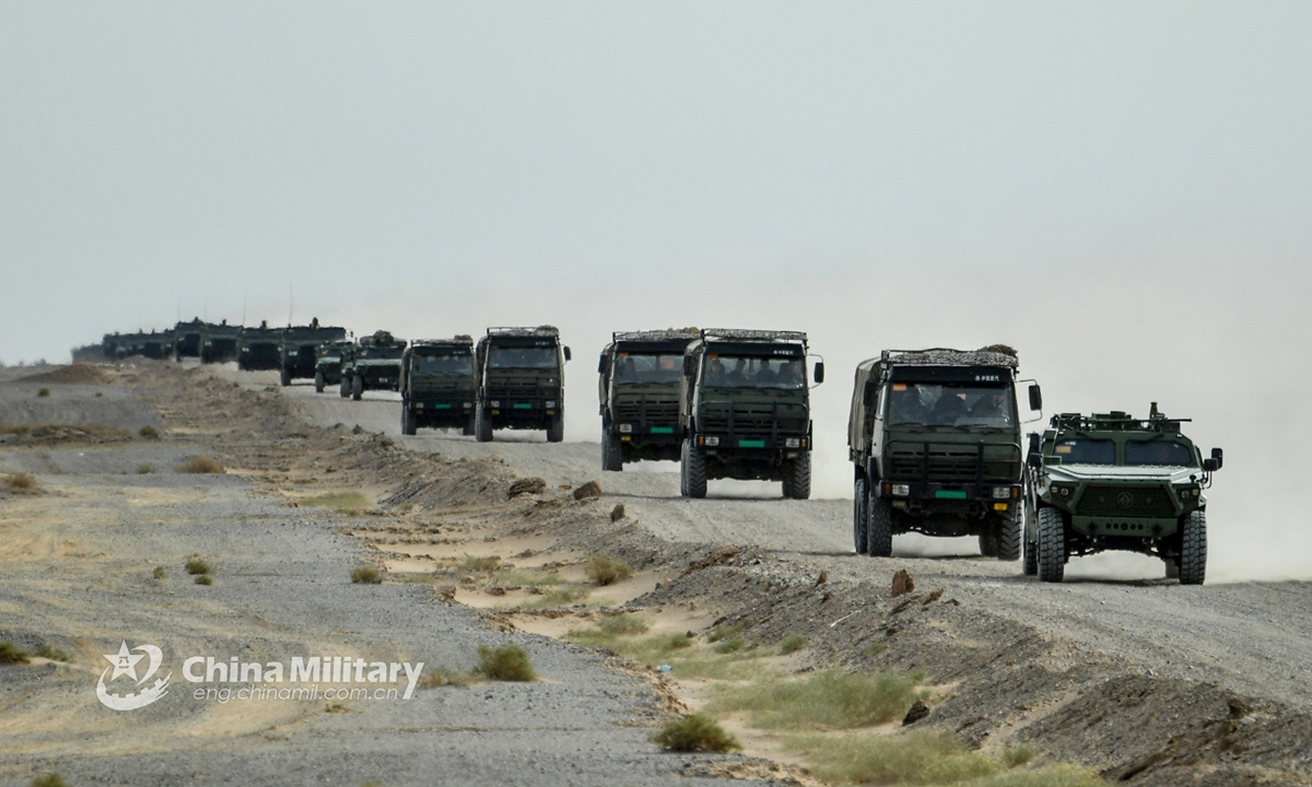 Military vehicles roll through strange areas - Global Times