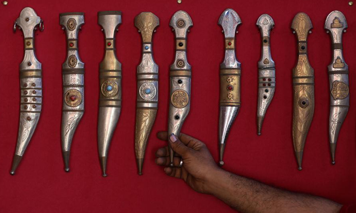 Palestinian craftsman makes traditional dagger at workshop in southern ...