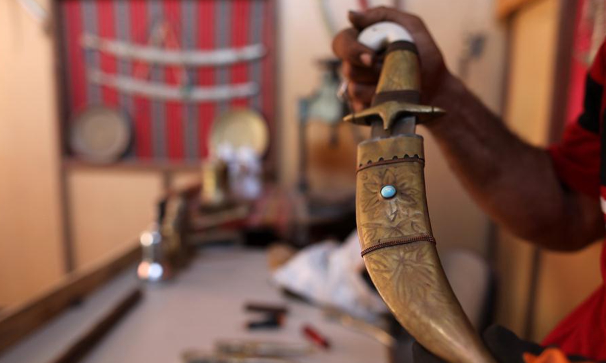 Palestinian craftsman makes traditional dagger at workshop in southern ...