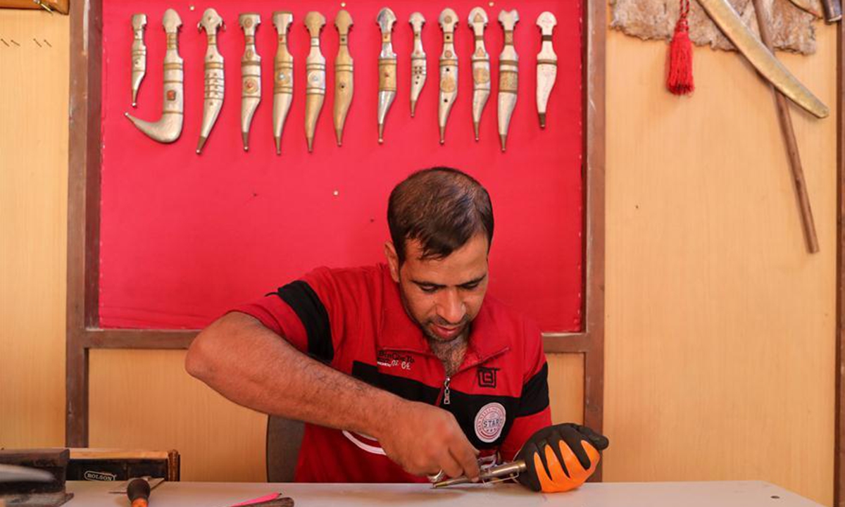 Palestinian craftsman makes traditional dagger at workshop in southern ...