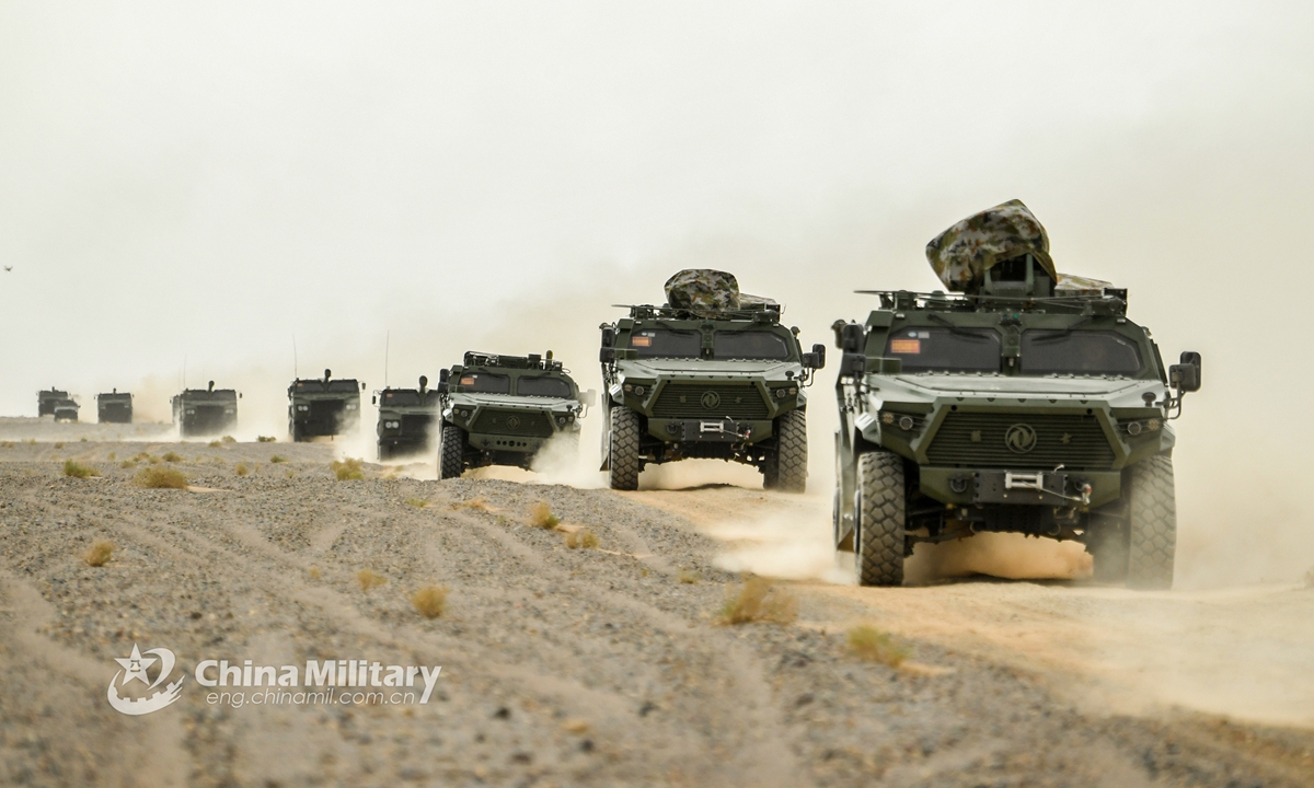 Military vehicles roll through strange areas - Global Times