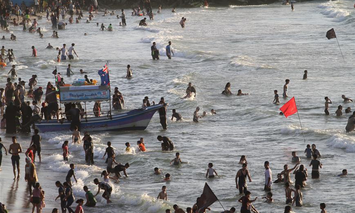 Palestinians enjoy their time at seaside in Gaza City - Global Times