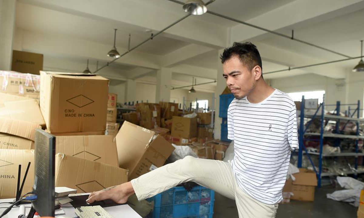 Pic story: armless man and his online store - Global Times