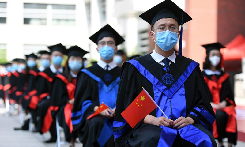 University graduates attend commencement ceremony amid COVID-19 ...