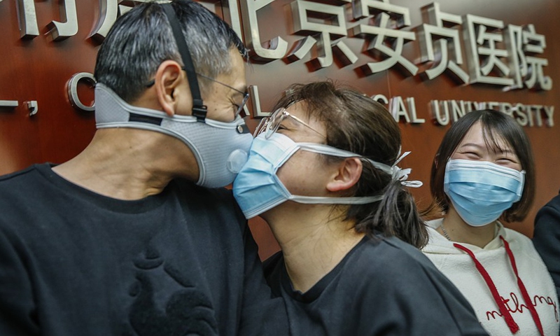 How people share a sweet kiss through face masks under COVID-19 ...