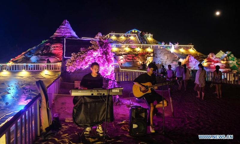 Tourists enjoy seaside time at Nansha beach resort in Zhejiang - Global ...