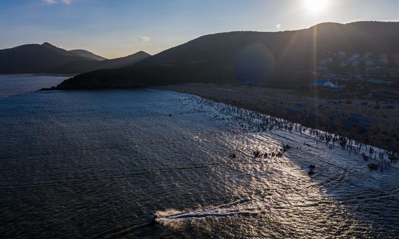 Tourists enjoy seaside time at Nansha beach resort in Zhejiang - Global ...