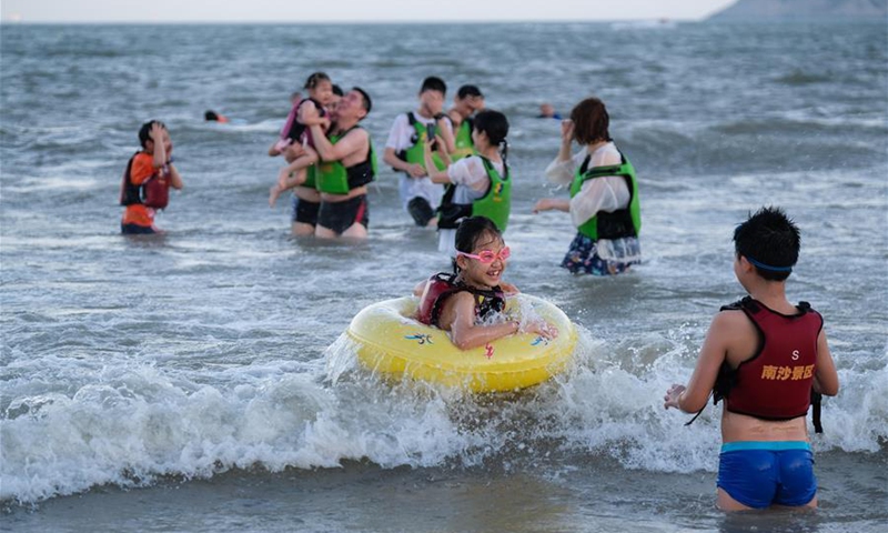Tourists enjoy seaside time at Nansha beach resort in Zhejiang - Global ...