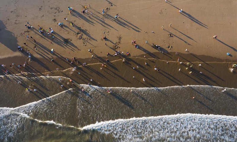 Tourists enjoy seaside time at Nansha beach resort in Zhejiang - Global ...