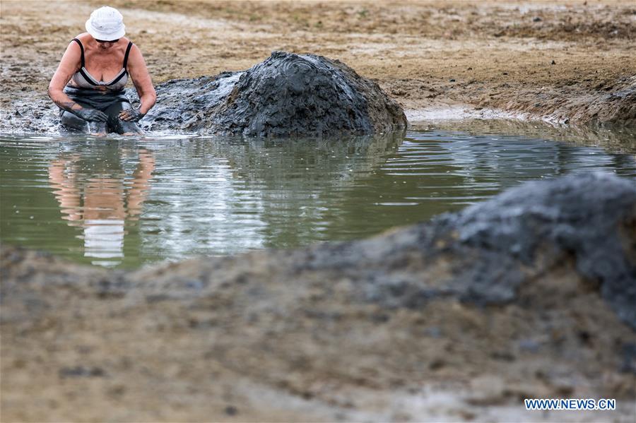 People take mud baths at Meline Beach on Island Krk in Croatia - Global ...