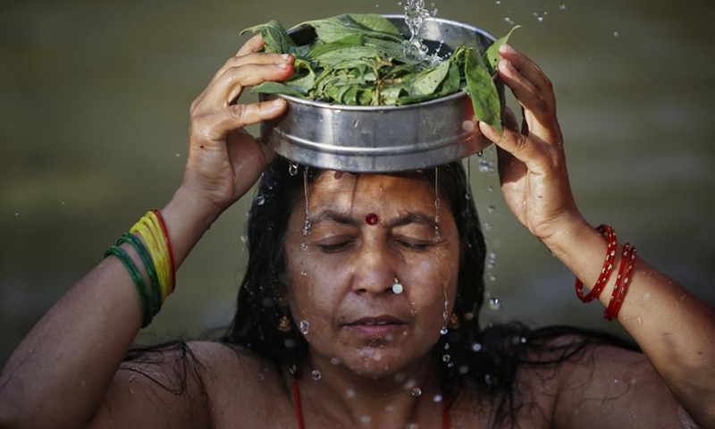 Nepalese Hindu women perform ritual during Rishi Panchami festival ...
