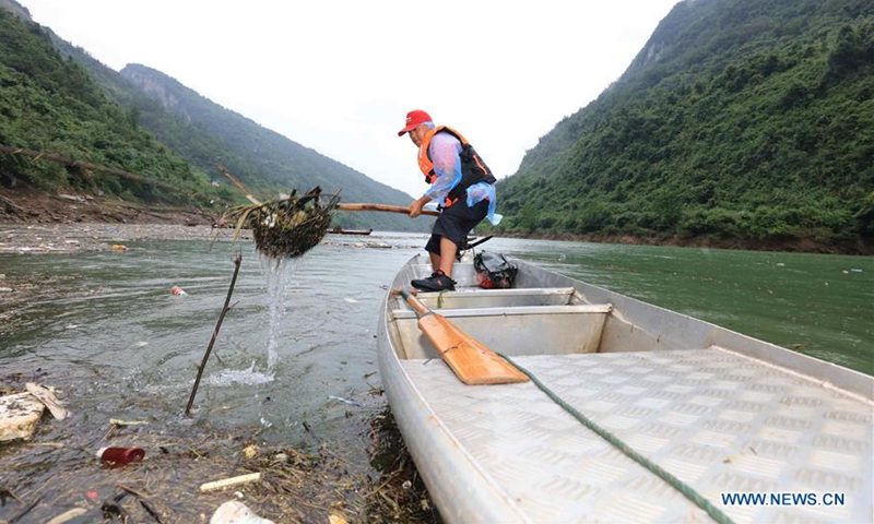 Villagers clear up flotage from Maoyan River in central China - Global ...