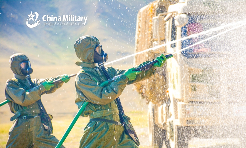 Chemical defense troops take samples from scenario affected area ...