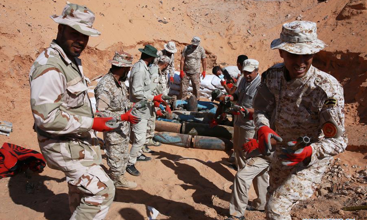 Fighters of UN-backed Libyan government move explosive remnants in old ...