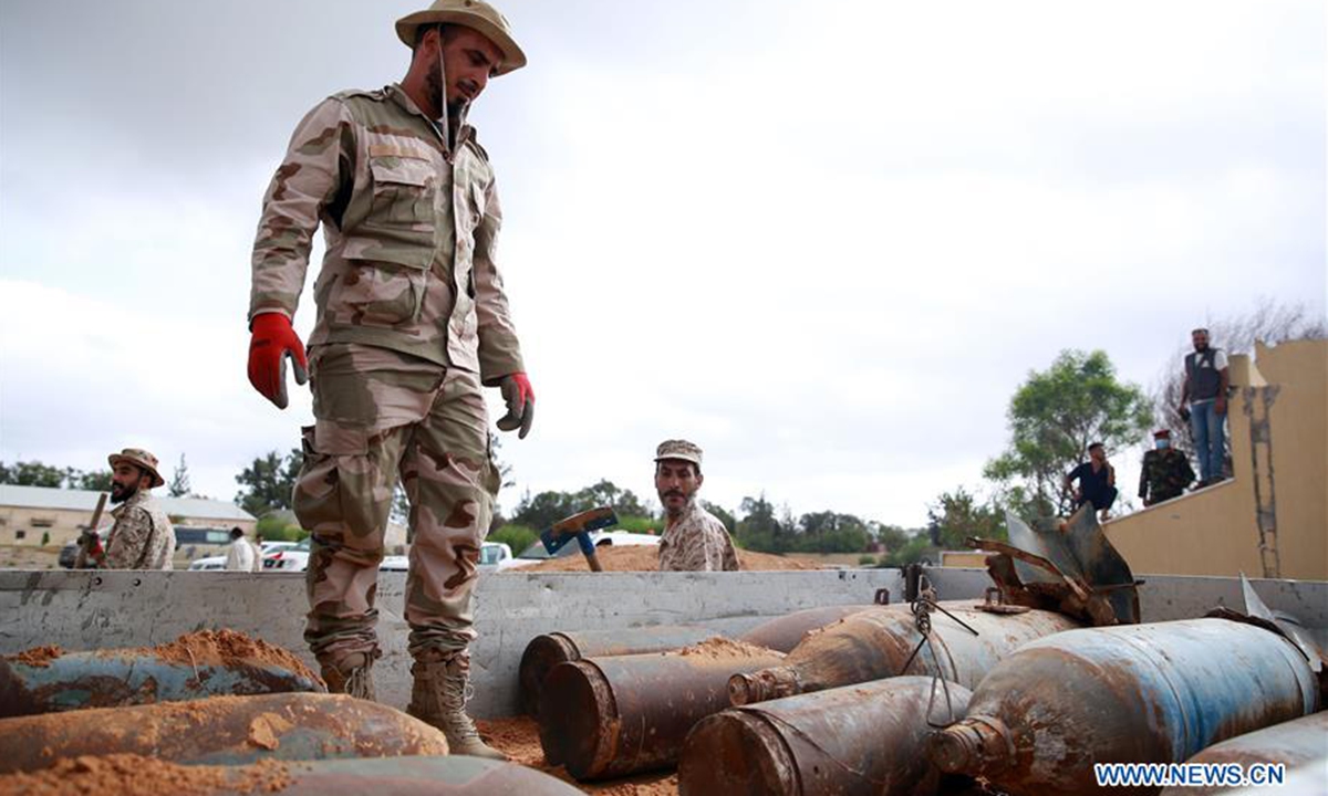 Fighters of UN-backed Libyan government move explosive remnants in old ...