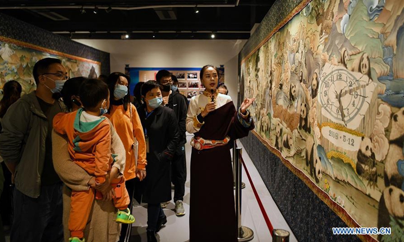 Visitors view panda-themed thangka at Sichuan Provincial Library ...