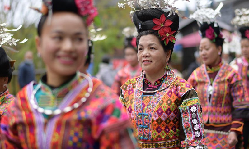 Villagers display traditional costumes at Danzhai Wanda Town, Guizhou ...