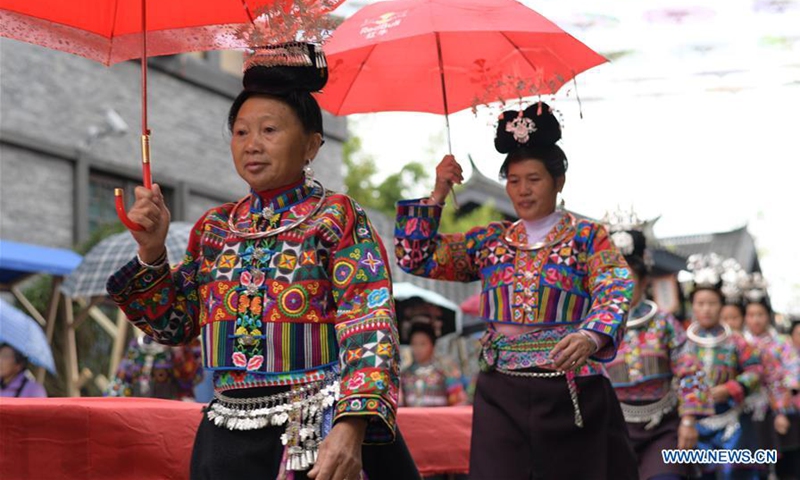 Villagers display traditional costumes at Danzhai Wanda Town, Guizhou ...