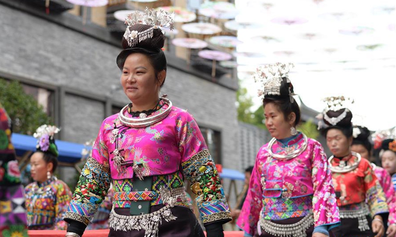 Villagers display traditional costumes at Danzhai Wanda Town, Guizhou ...