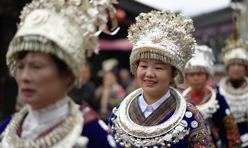 Villagers display traditional costumes at Danzhai Wanda Town, Guizhou ...