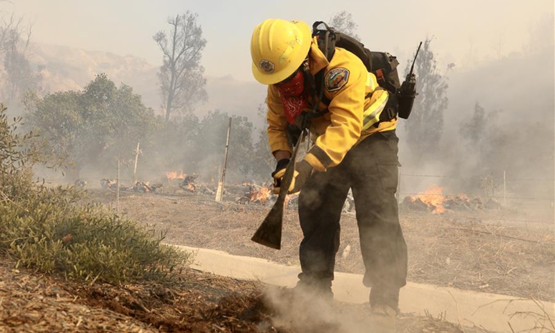 Raging wildfires injure two firefighters in California, force massive ...