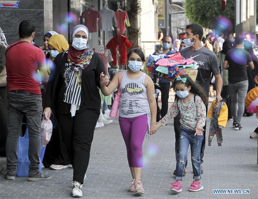 Palestinians wear face masks in Gaza City - Global Times