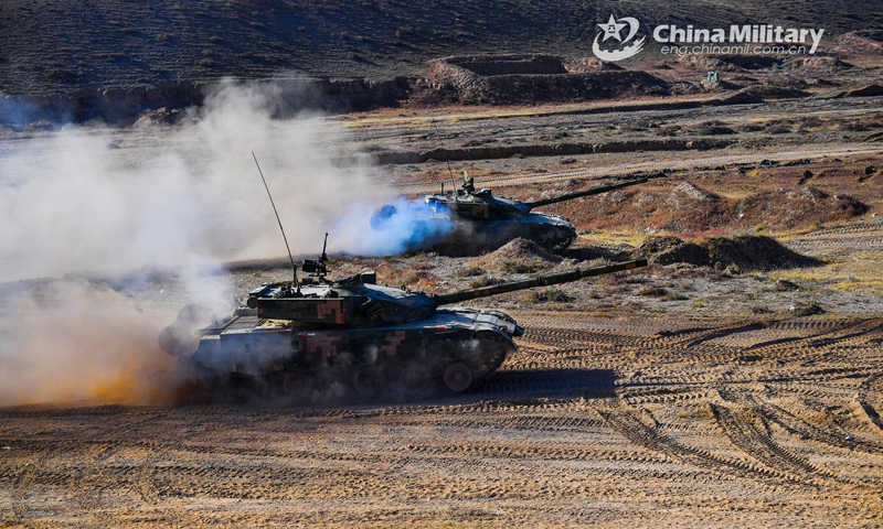 Tanks fire towards simulated enemies - Global Times