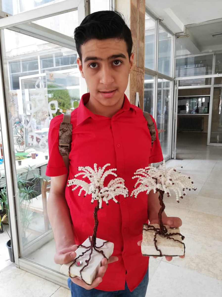 Syrian autistic teen develops hobby of making bead ornaments - Global Times