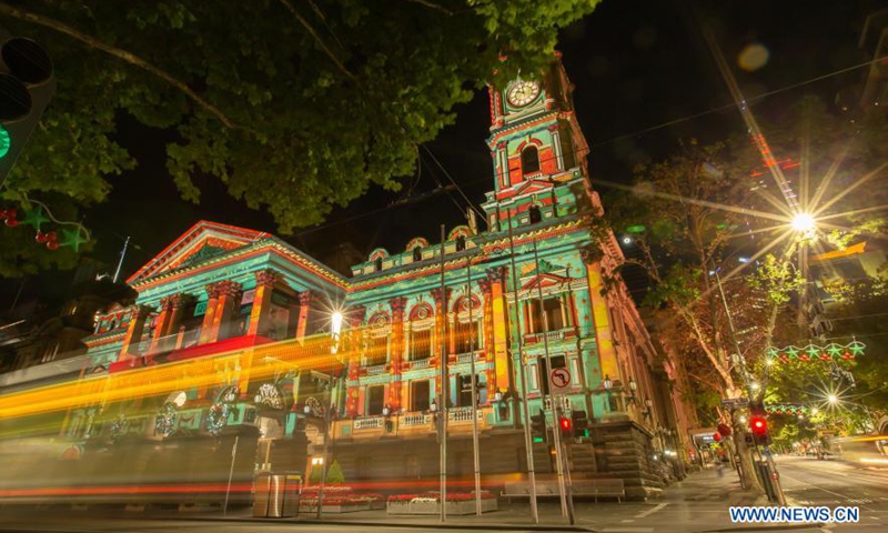 People view Christmas light projections in Melbourne, Australia ...