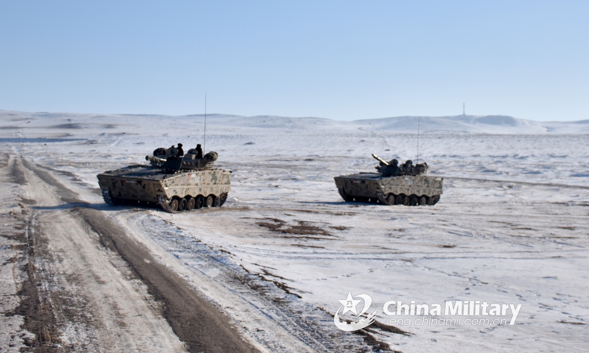Soldiers drive armored vehicles on snow ground - Global Times
