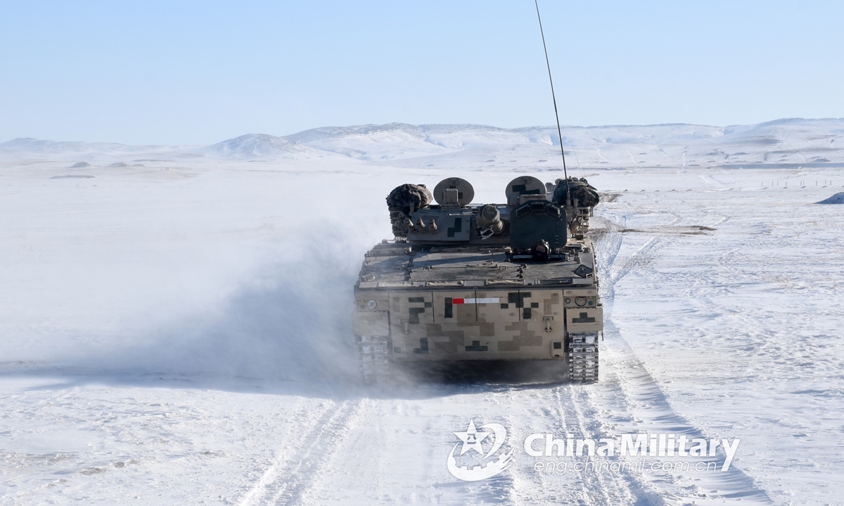Soldiers drive armored vehicles on snow ground - Global Times