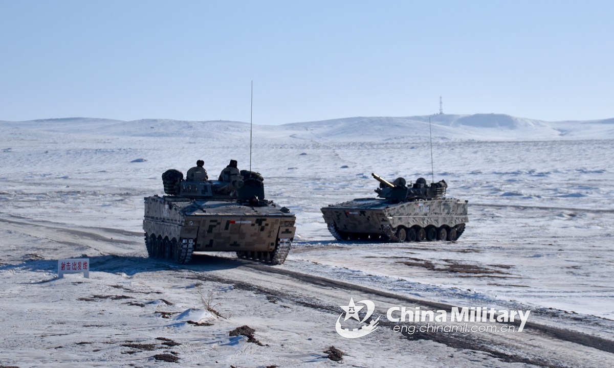 Soldiers drive armored vehicles on snow ground - Global Times